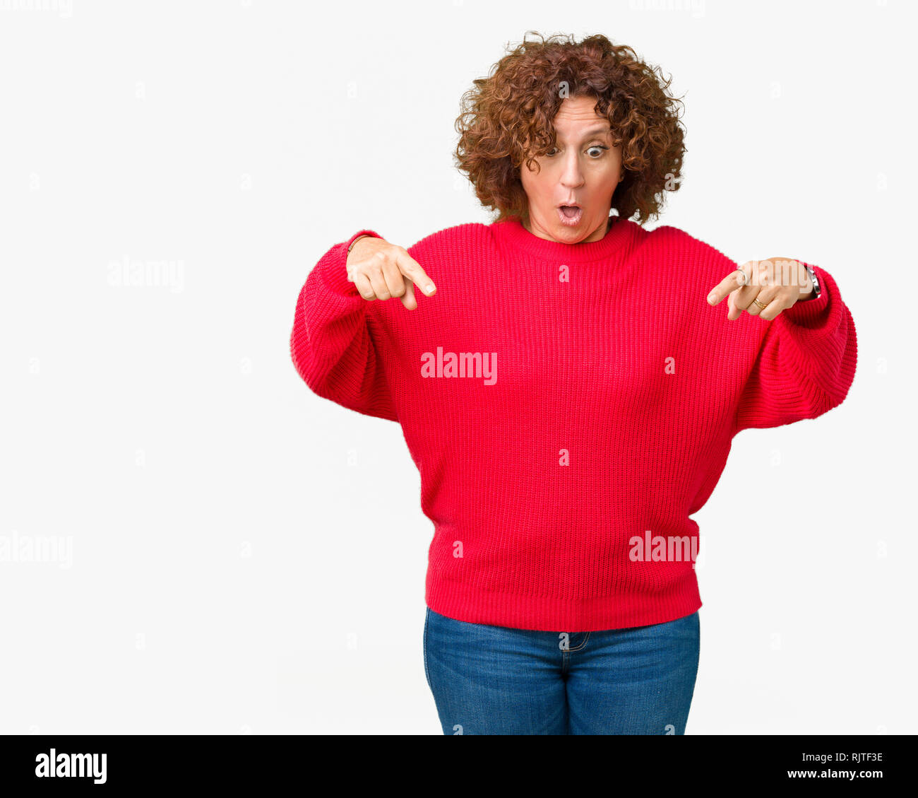 Beautiful middle ager senior woman red winter sweater over isolated ...