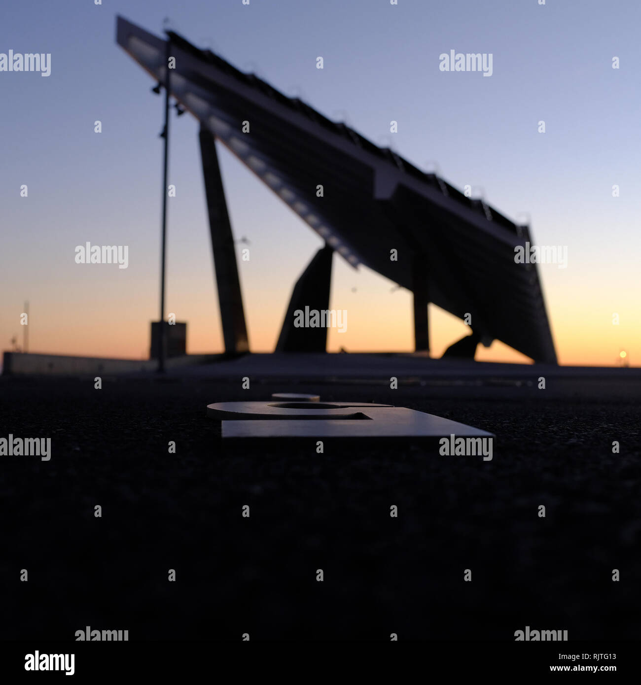 Solar Panel Structure Framework silhouetted against the dawn sky with a ...