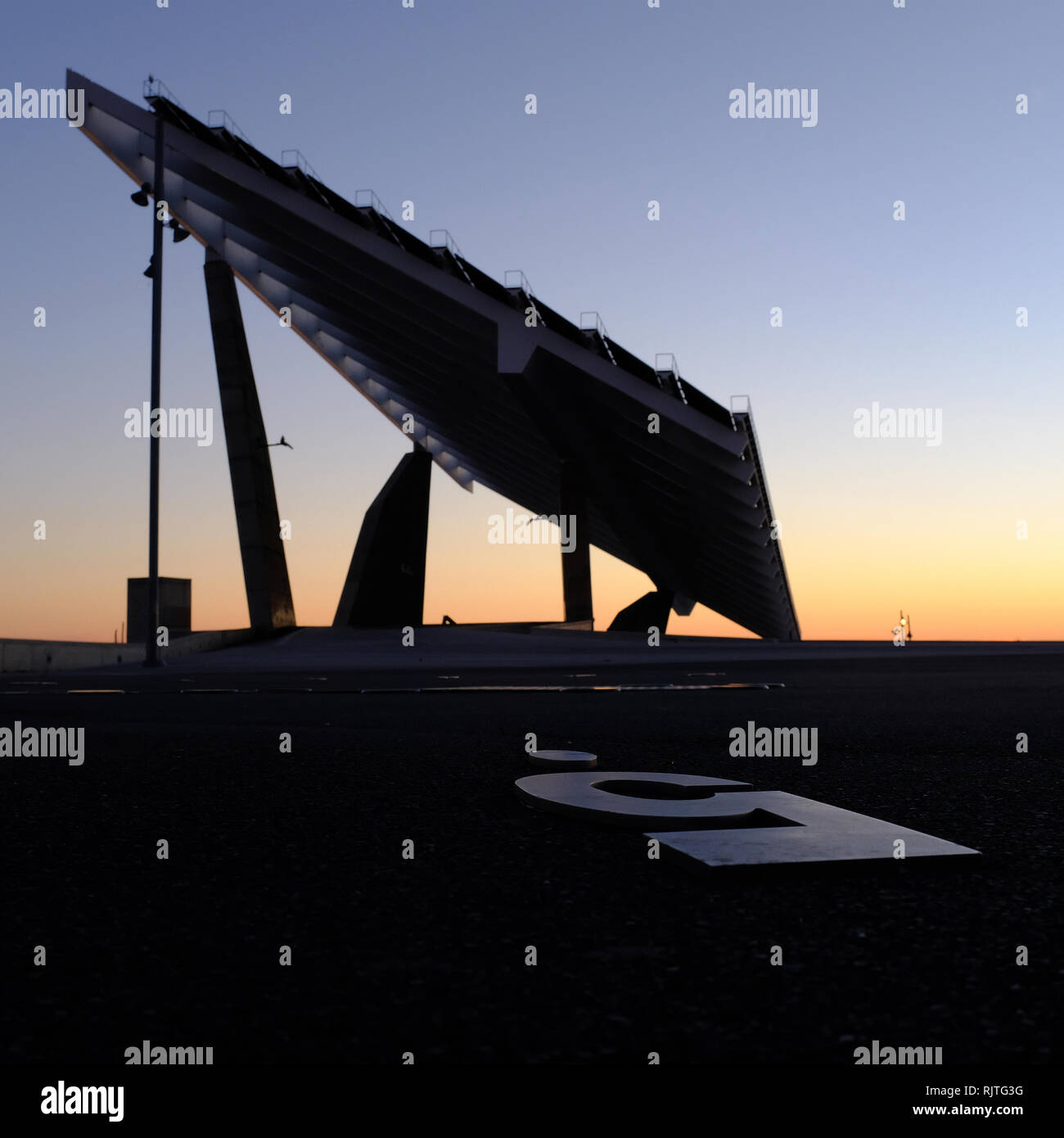Solar Panel Structure Framework silhouetted against the dawn sky with a ...