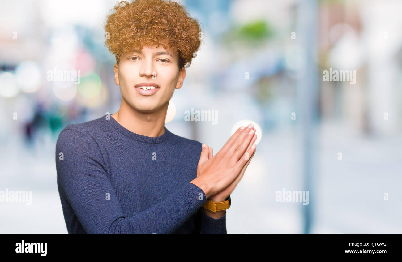Young handsome man with afro hair Clapping and applauding happy and ...