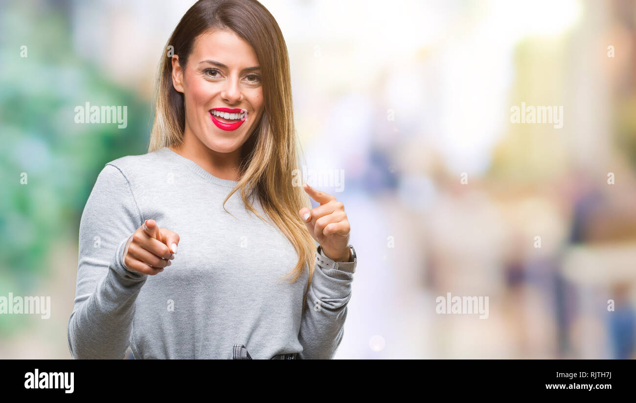 Young beautiful worker business woman over isolated background pointing ...