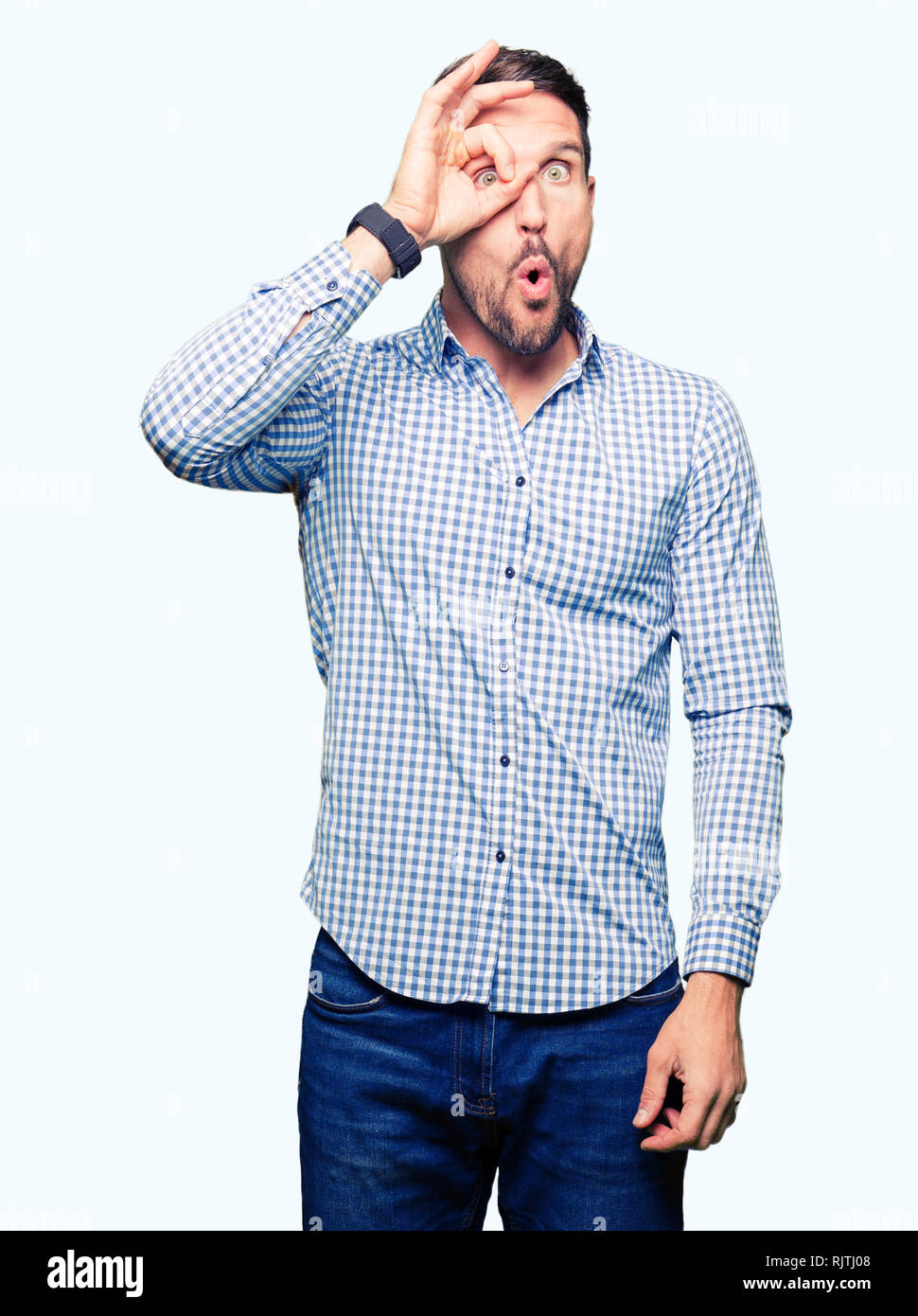 Handsome business man with blue eyes doing ok gesture shocked with ...