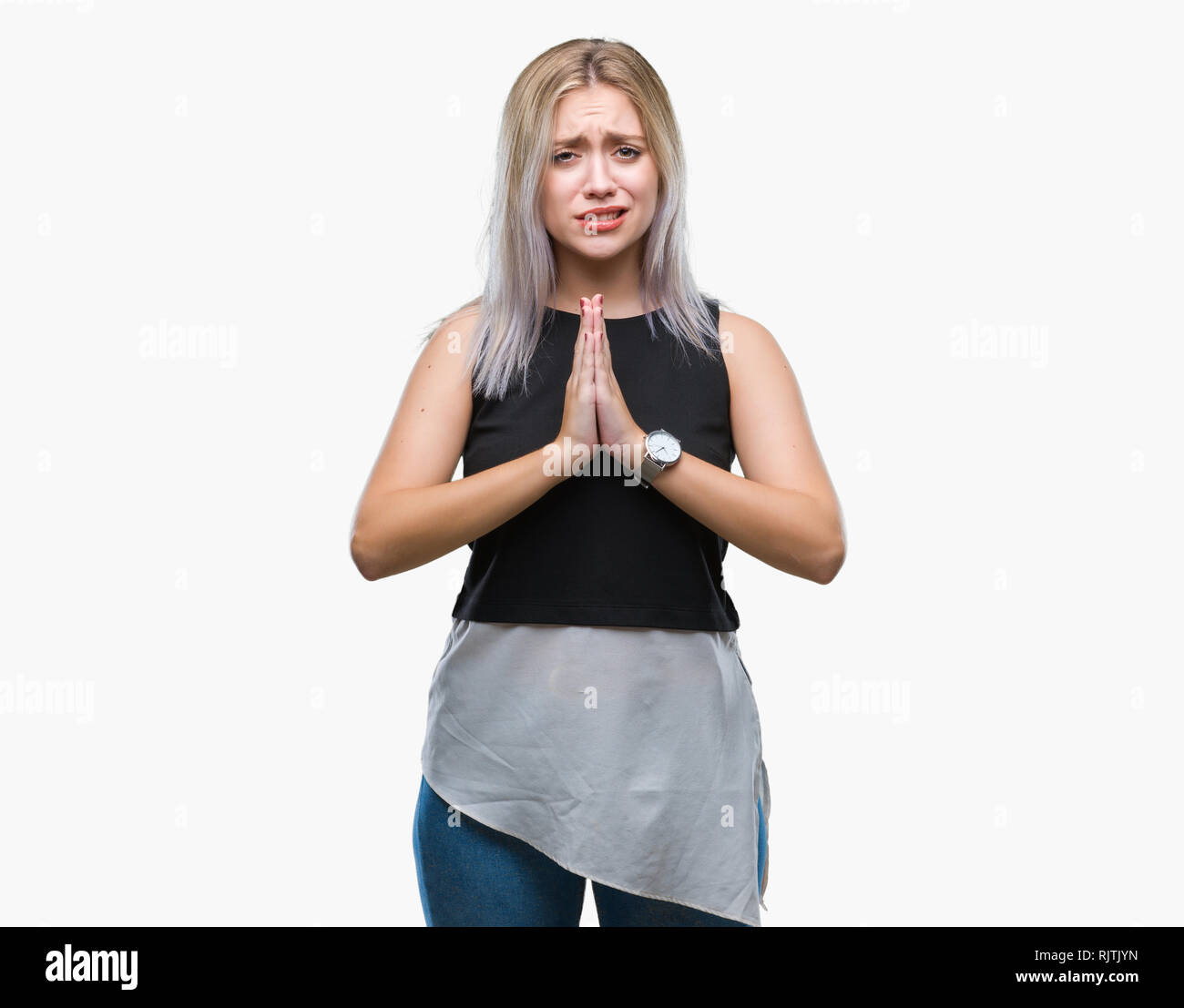 Young blonde woman over isolated background begging and praying with ...