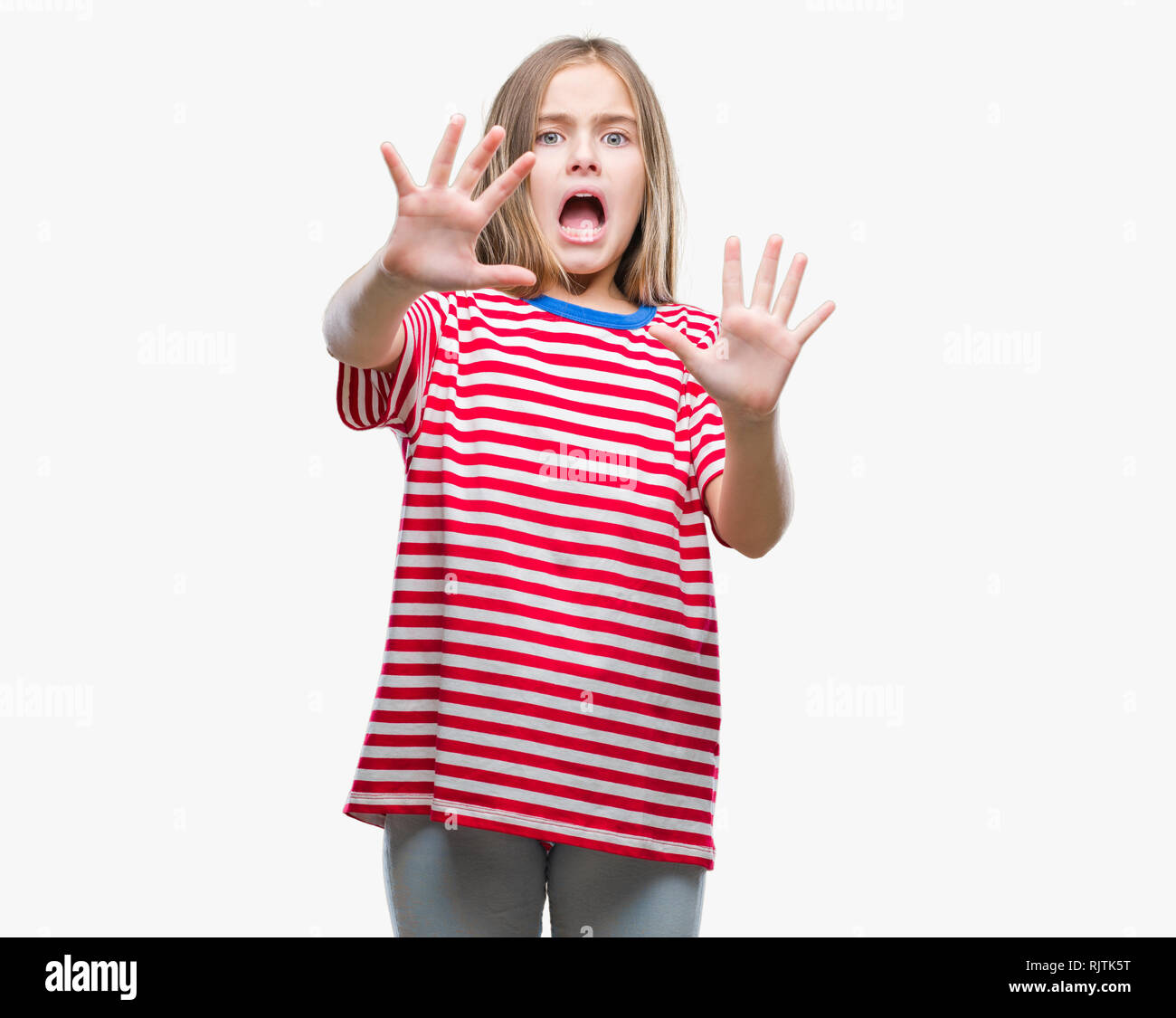 Young beautiful girl over isolated background afraid and terrified with ...