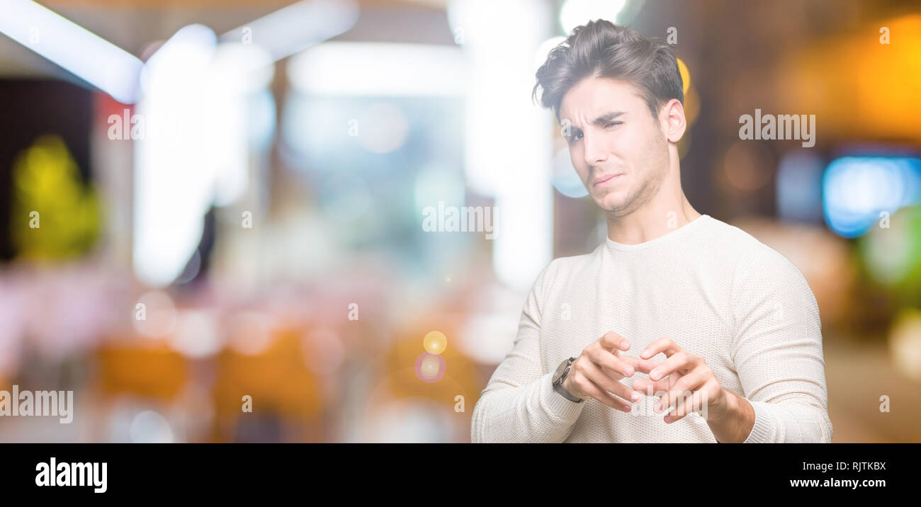 Young handsome man over isolated background disgusted expression ...