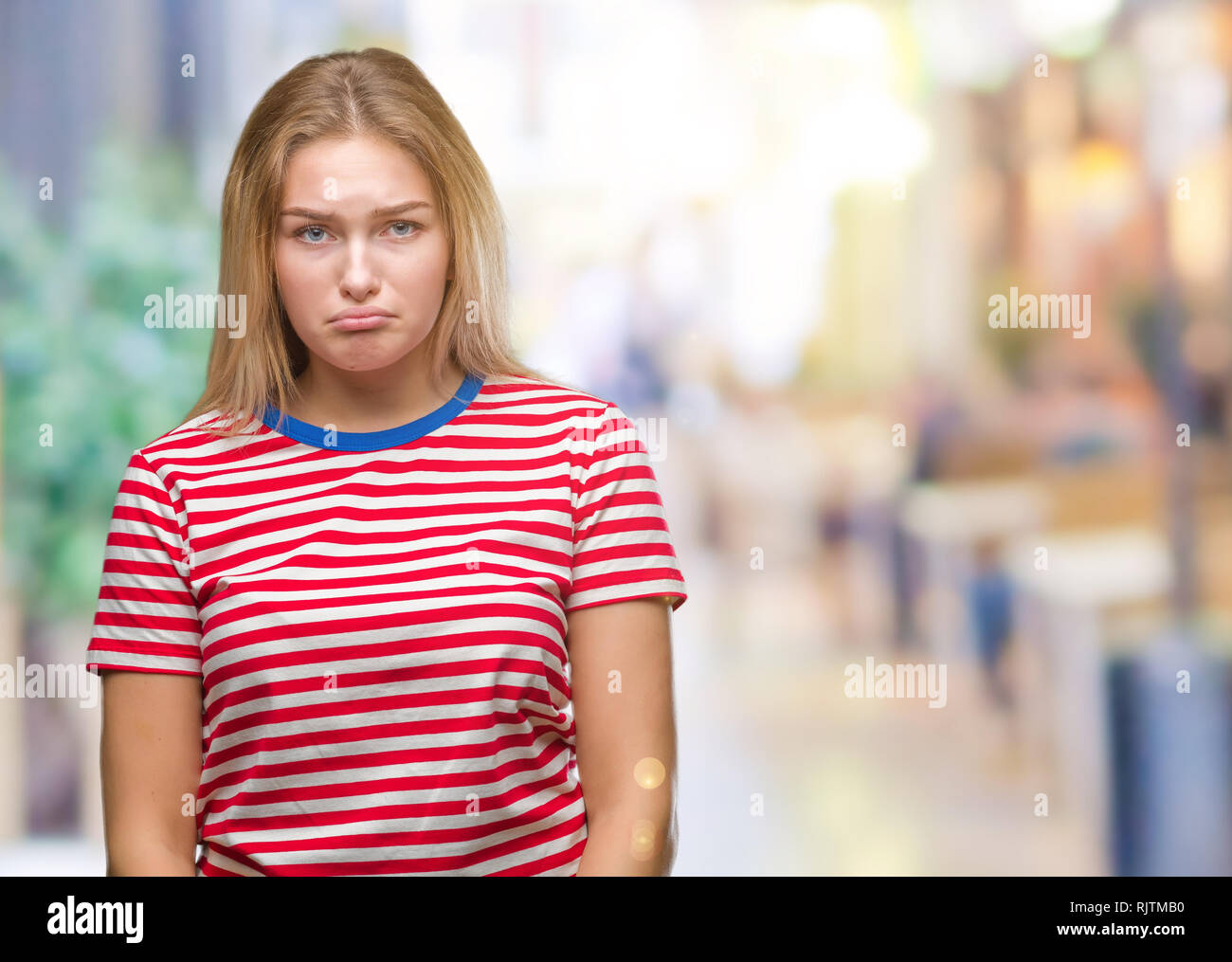 Young caucasian woman over isolated background depressed and worry for ...