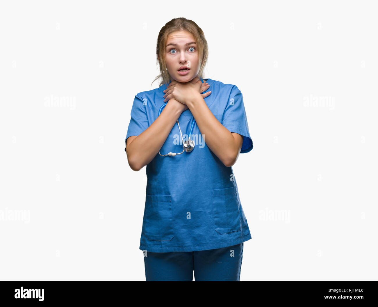 Young caucasian doctor woman wearing surgeon uniform over isolated ...
