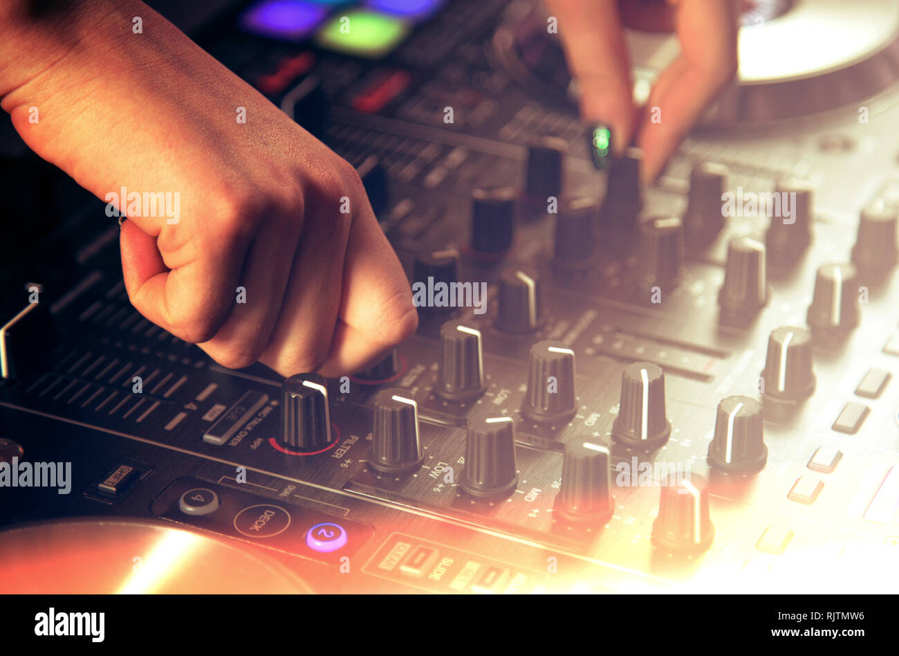 DJ Hand Mixing on Controller Stock Photo - Alamy