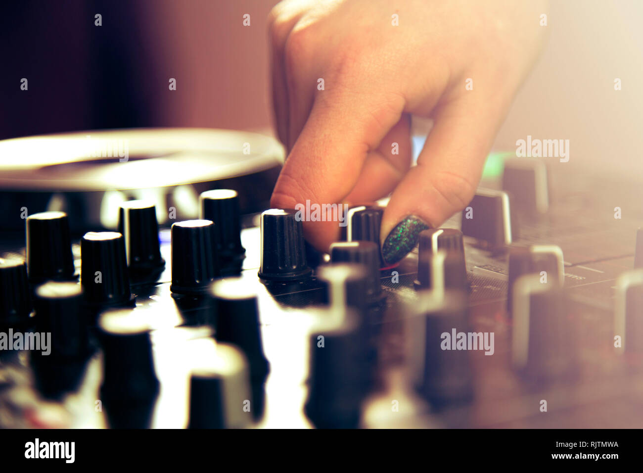 DJ Hand Mixing on Controller Stock Photo - Alamy