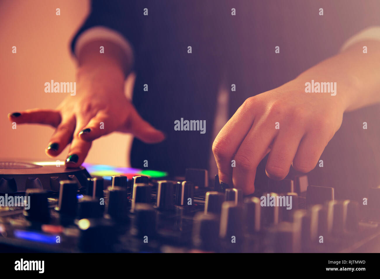 DJ Hand Mixing on Controller Stock Photo - Alamy