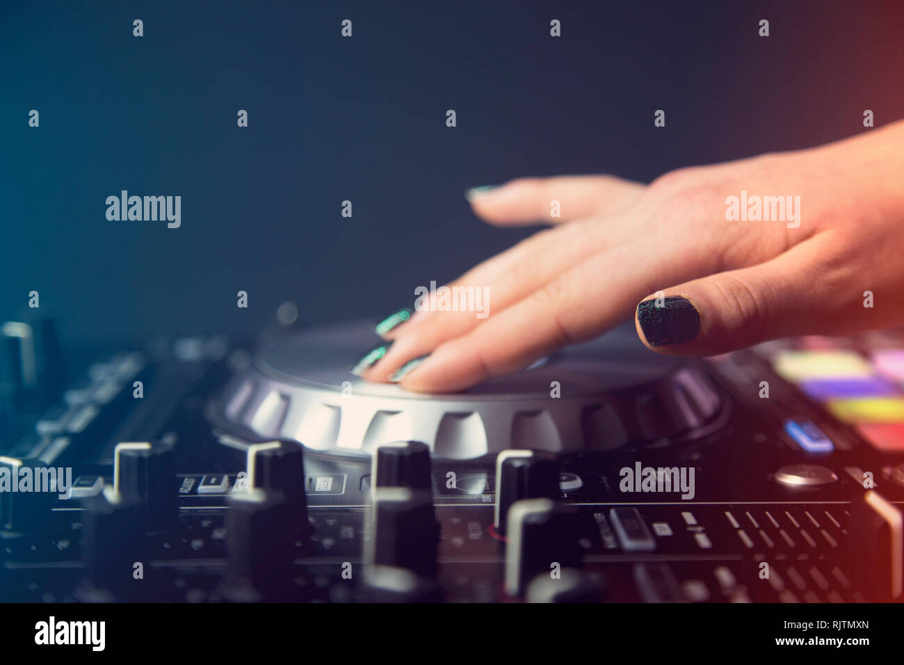 DJ Hand Mixing on Controller Stock Photo - Alamy