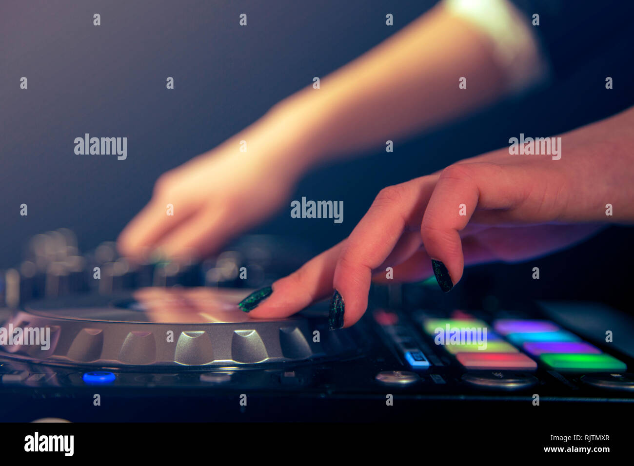 DJ Hand Mixing on Controller Stock Photo - Alamy