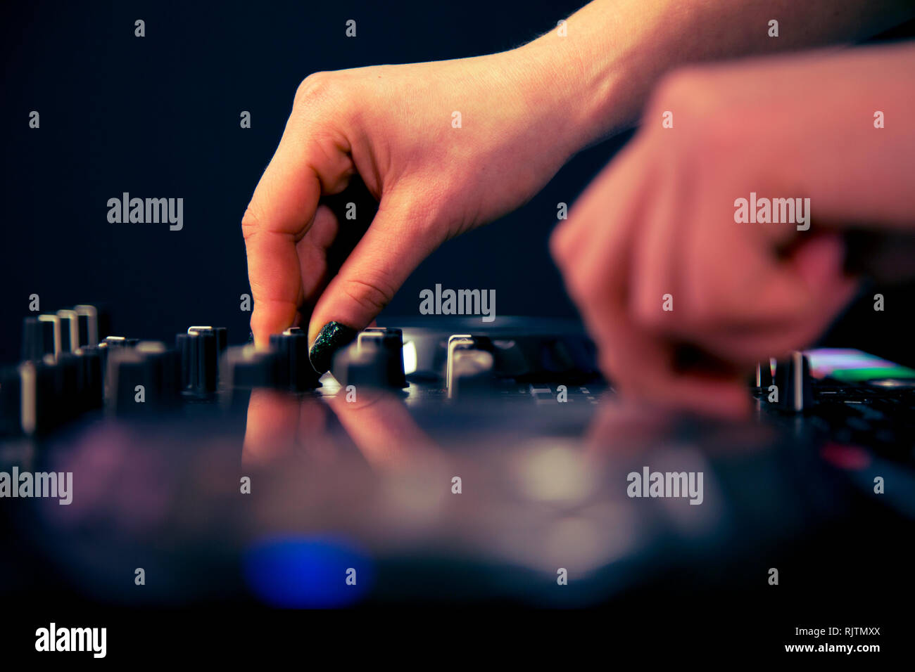 DJ Hand Mixing on Controller Stock Photo - Alamy