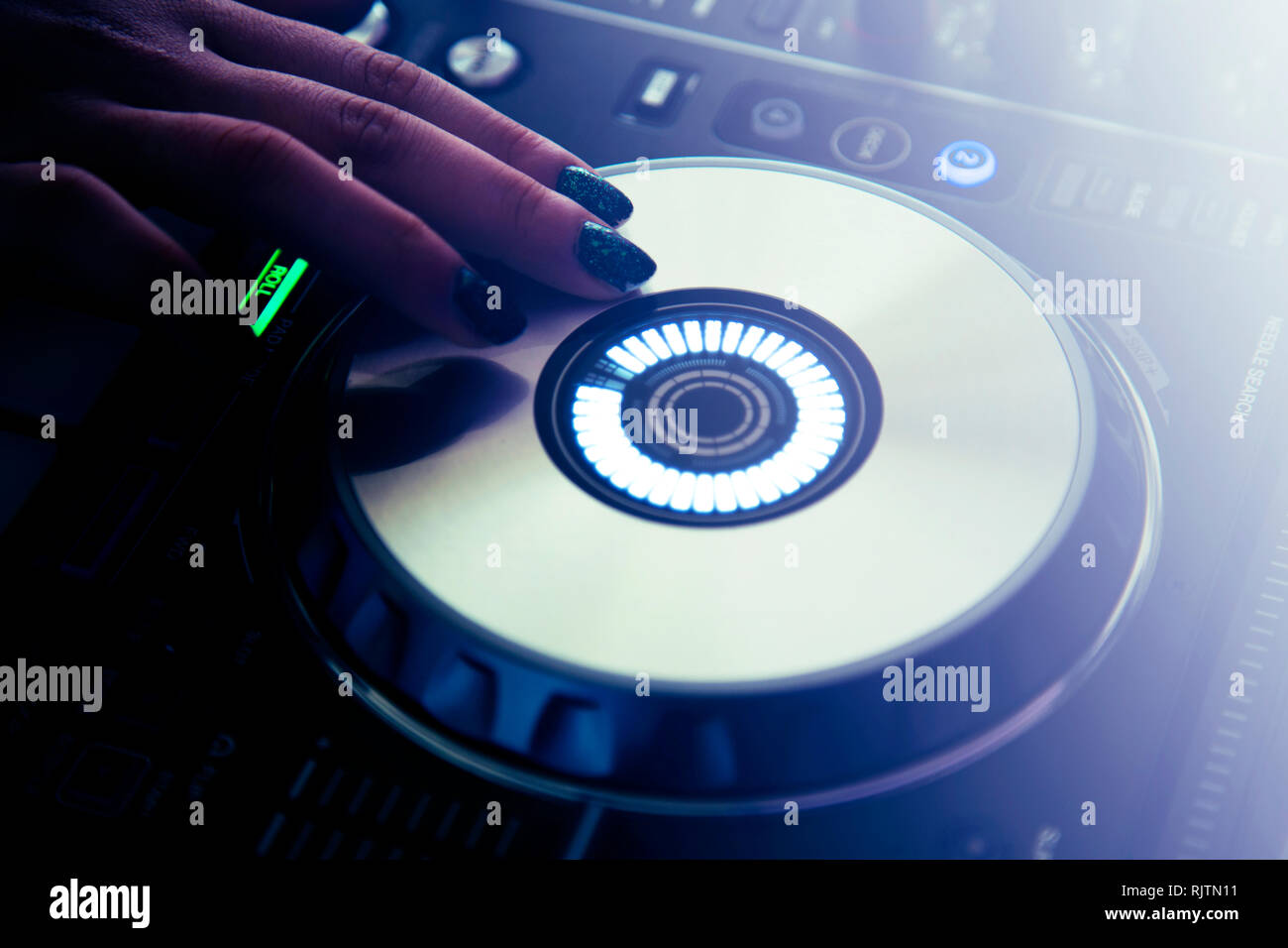 DJ Hand Mixing on Controller Stock Photo - Alamy