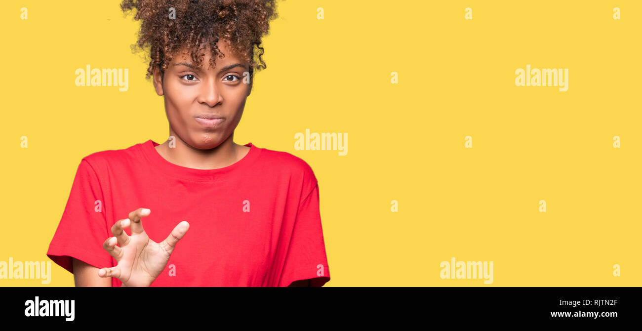 Beautiful young african american woman over isolated background ...