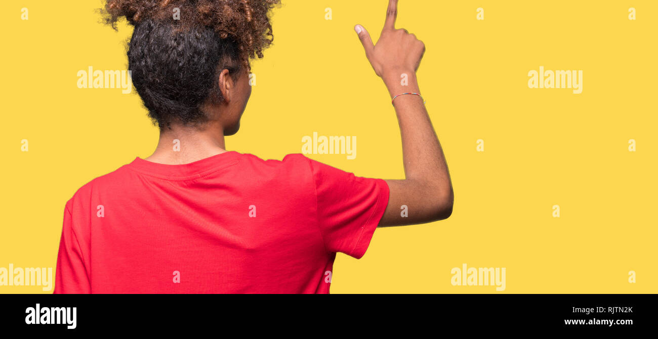 Beautiful young african american woman over isolated background Posing ...