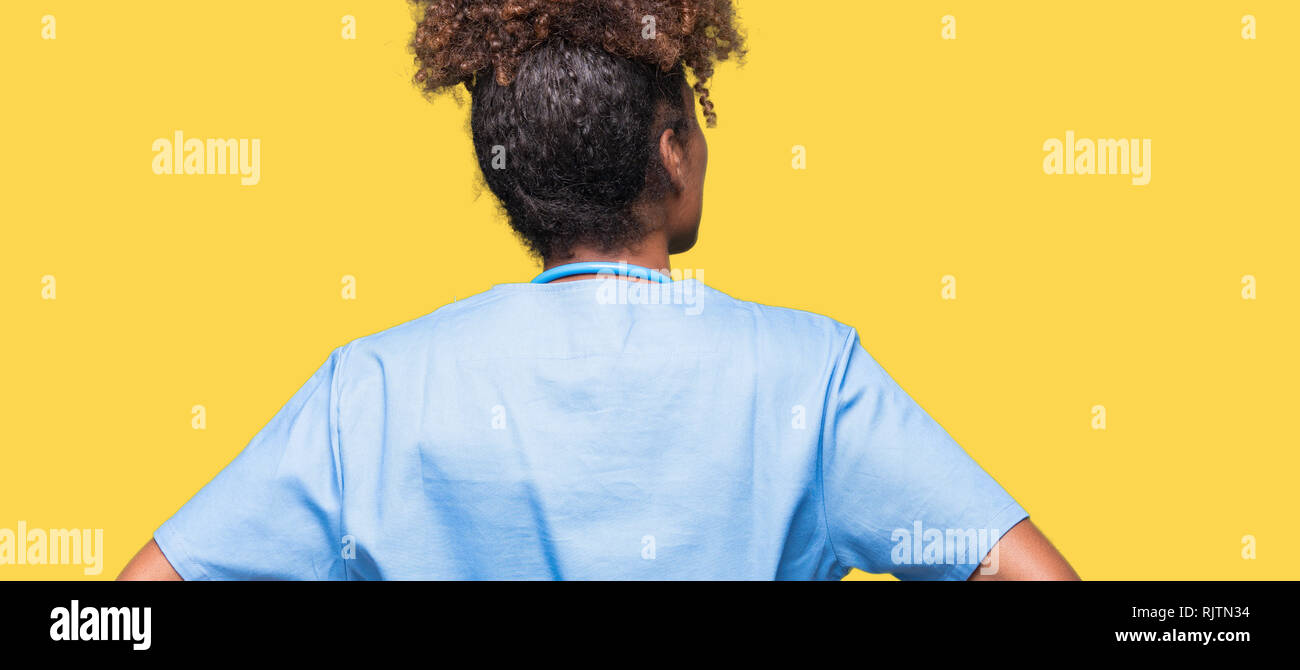 Young african american doctor woman over isolated background standing ...