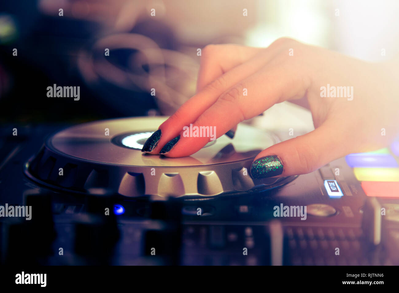 DJ Hand Mixing on Controller Stock Photo - Alamy