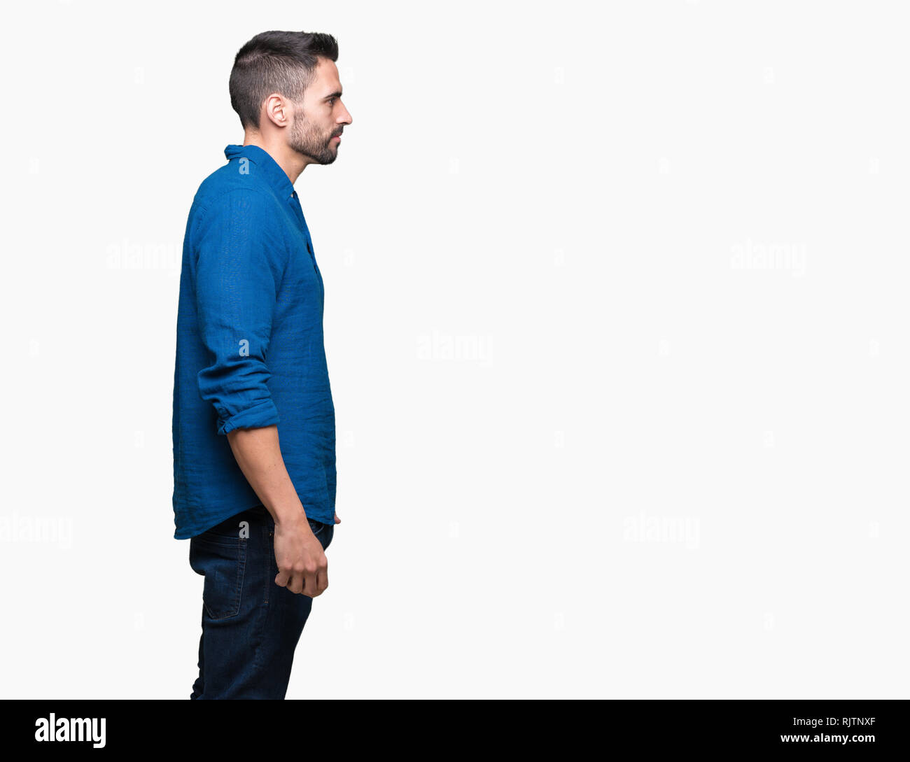 Young handsome man over isolated background looking to side, relax ...