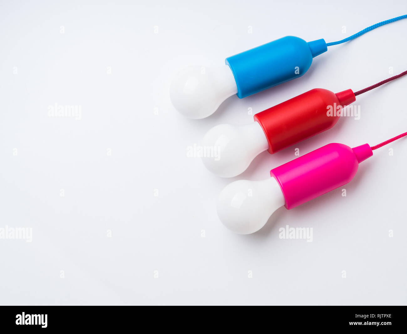Three color light bulb lamps on white. Concept Stock Photo - Alamy