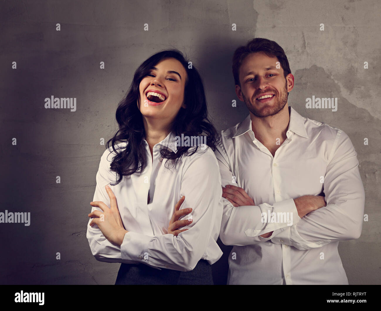Happy toothy laughing business woman and smiling businessman in white ...