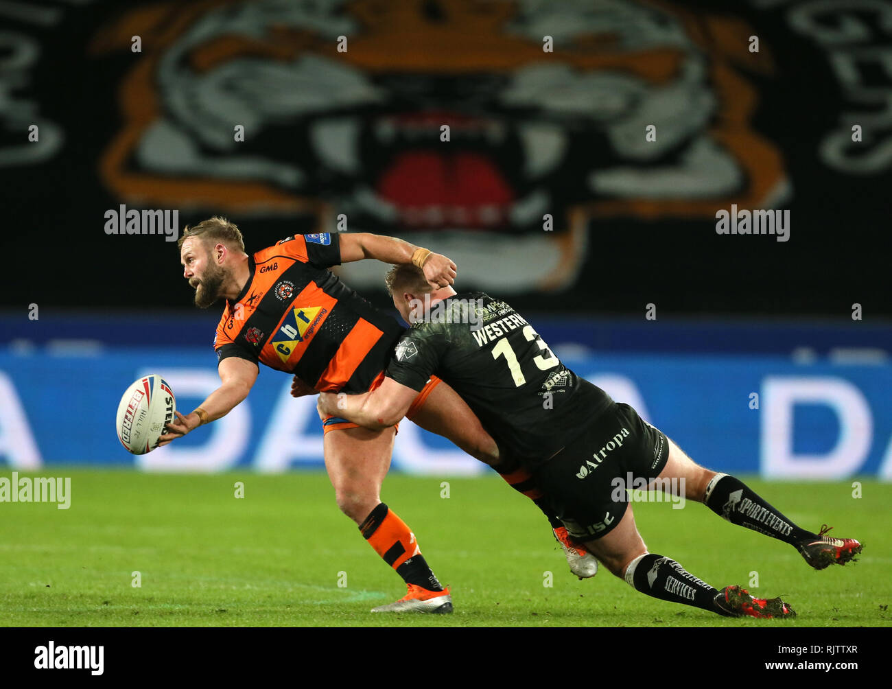 Castleford Tigers' Paul McShane (left) passes the ball during the ...
