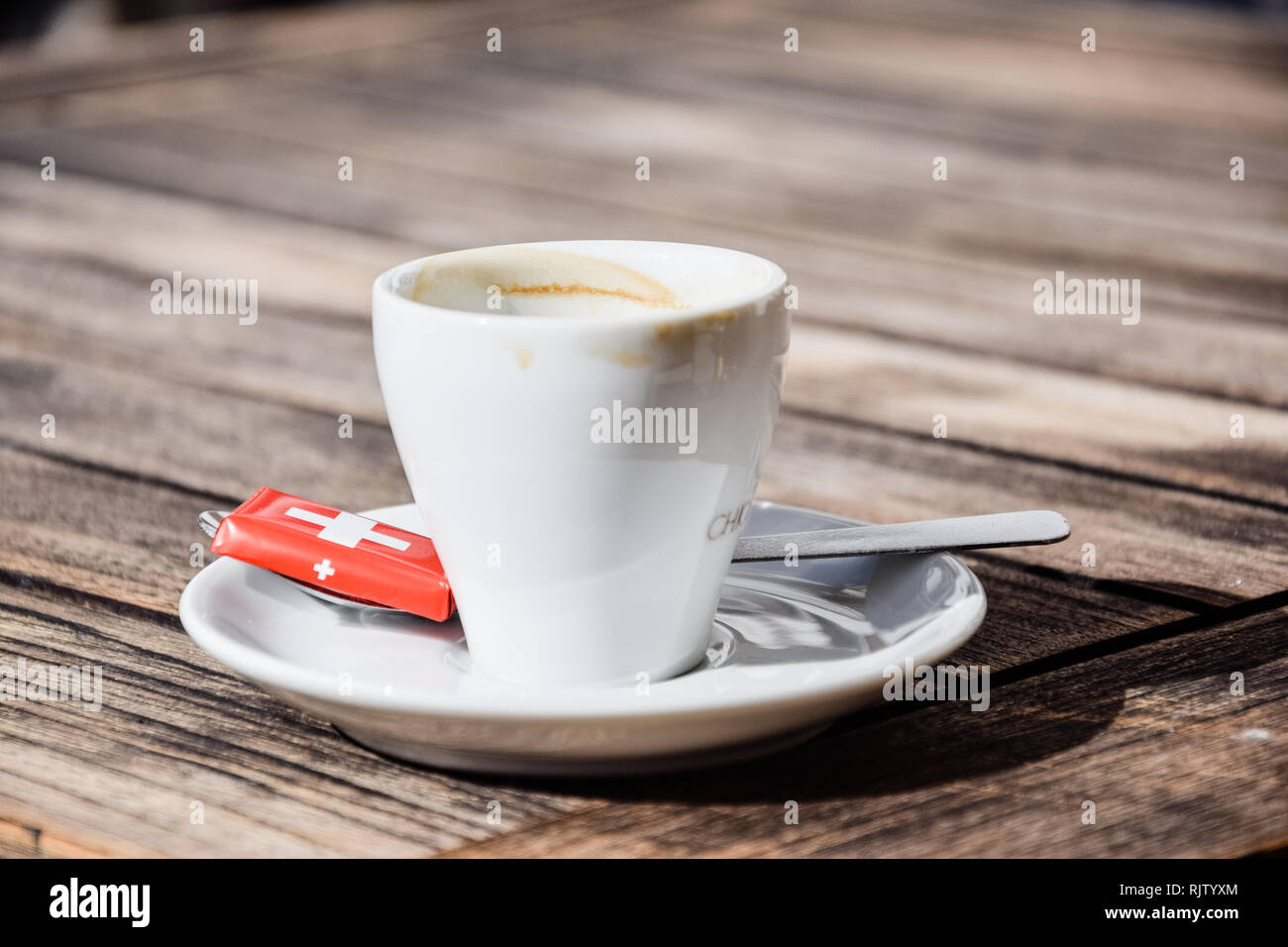 Empty espresso cup with Swiss chocolate Stock Photo - Alamy