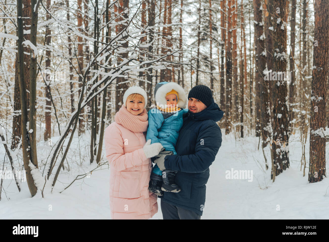 Walking family with a child. Family walks in nature in winter. Winter ...