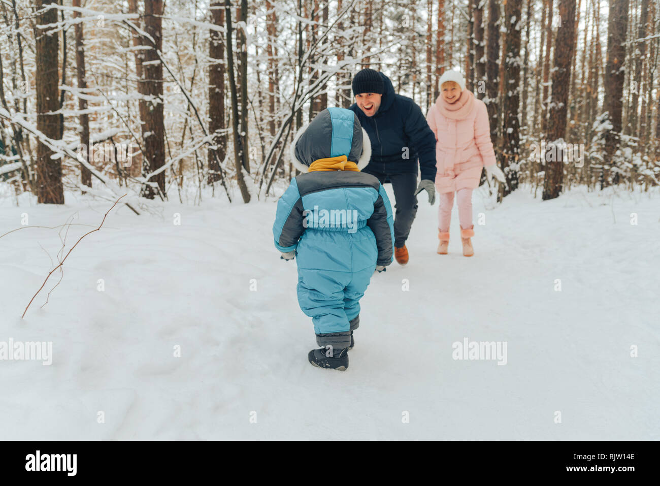 Walking family with a child. Family walks in nature in winter. Winter ...