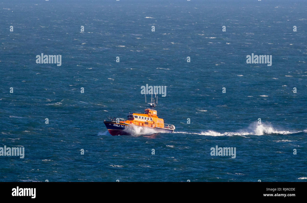 A Trent class RNLI lifeboat sails near Old Harry Rocks in Studland ...