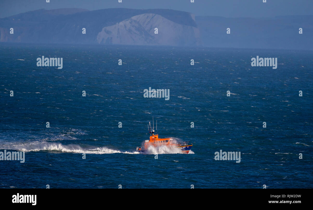 A Trent class RNLI lifeboat sails near Old Harry Rocks in Studland ...