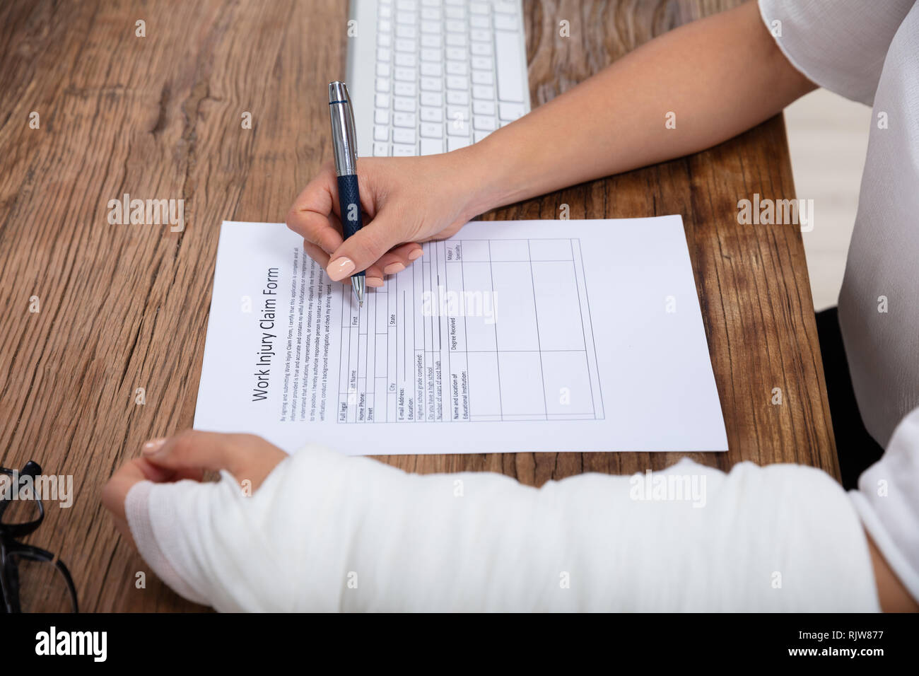 Close-up Of Businesswoman With White Bandage Hand Filling Work Injury ...