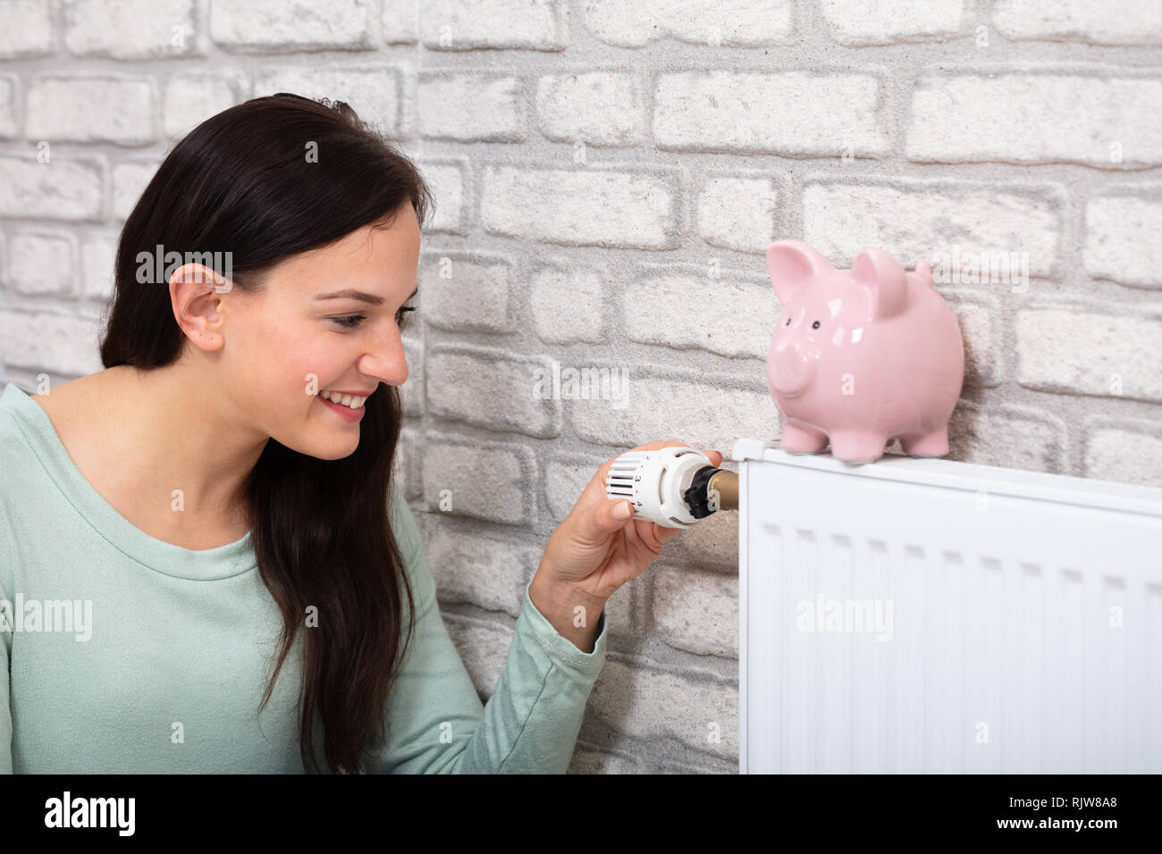 Woman sitting on radiator hi-res stock photography and images - Alamy