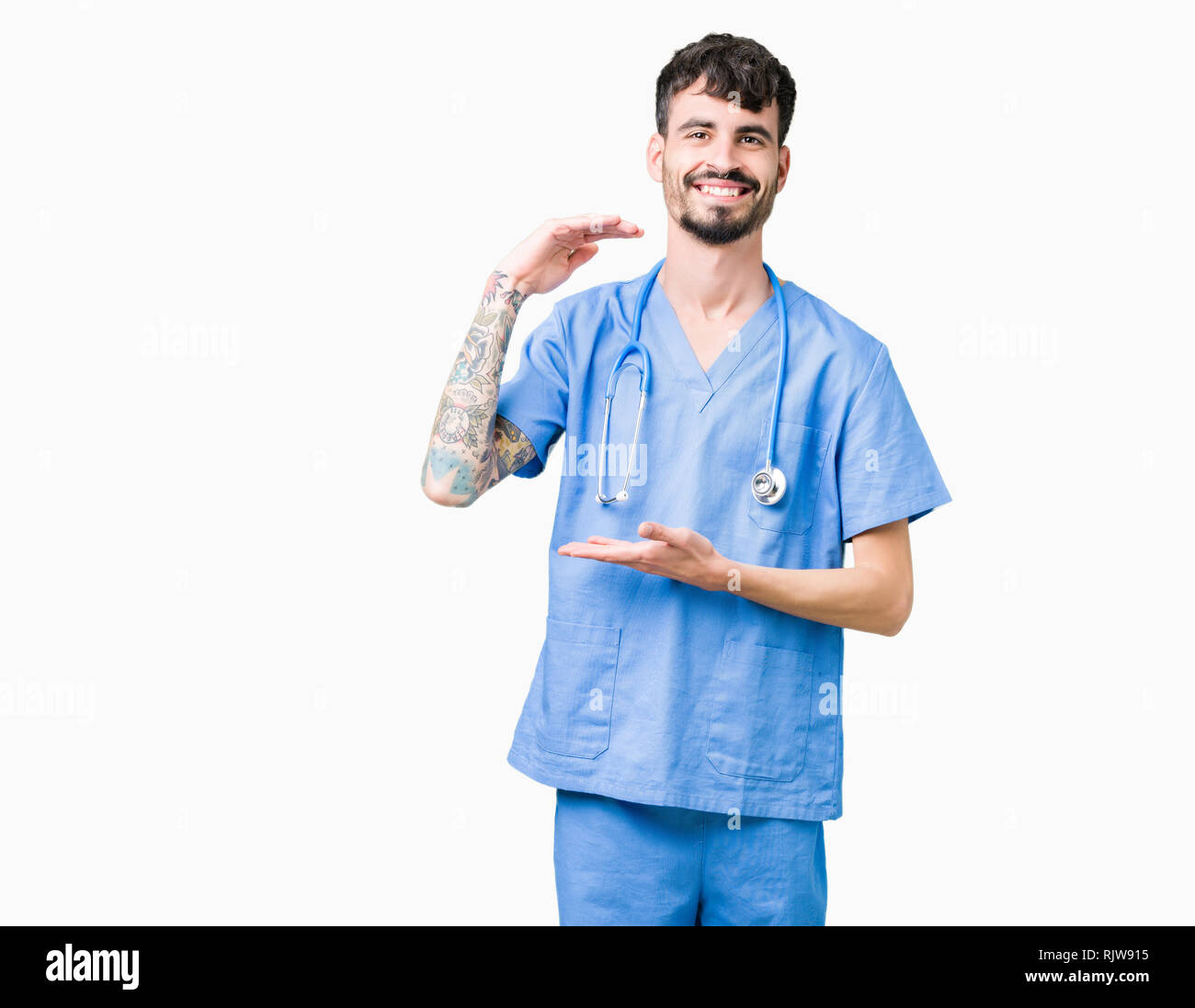 Young handsome nurse man wearing surgeon uniform over isolated ...