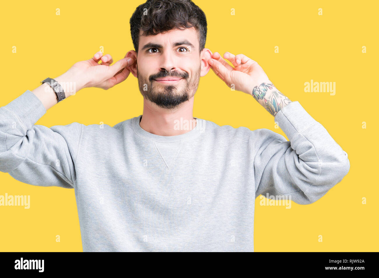 Young handsome man wearing sweatshirt over isolated background Smiling ...