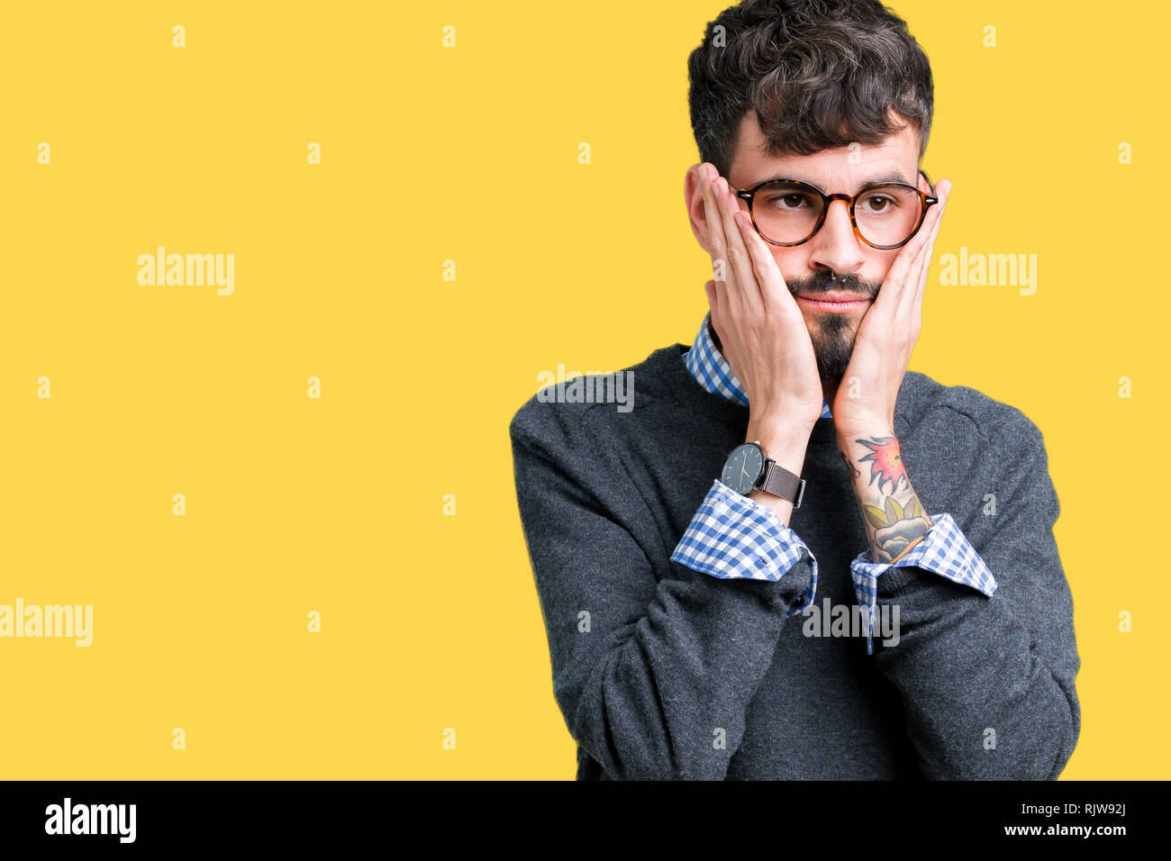 Young handsome smart man wearing glasses over isolated background Tired ...