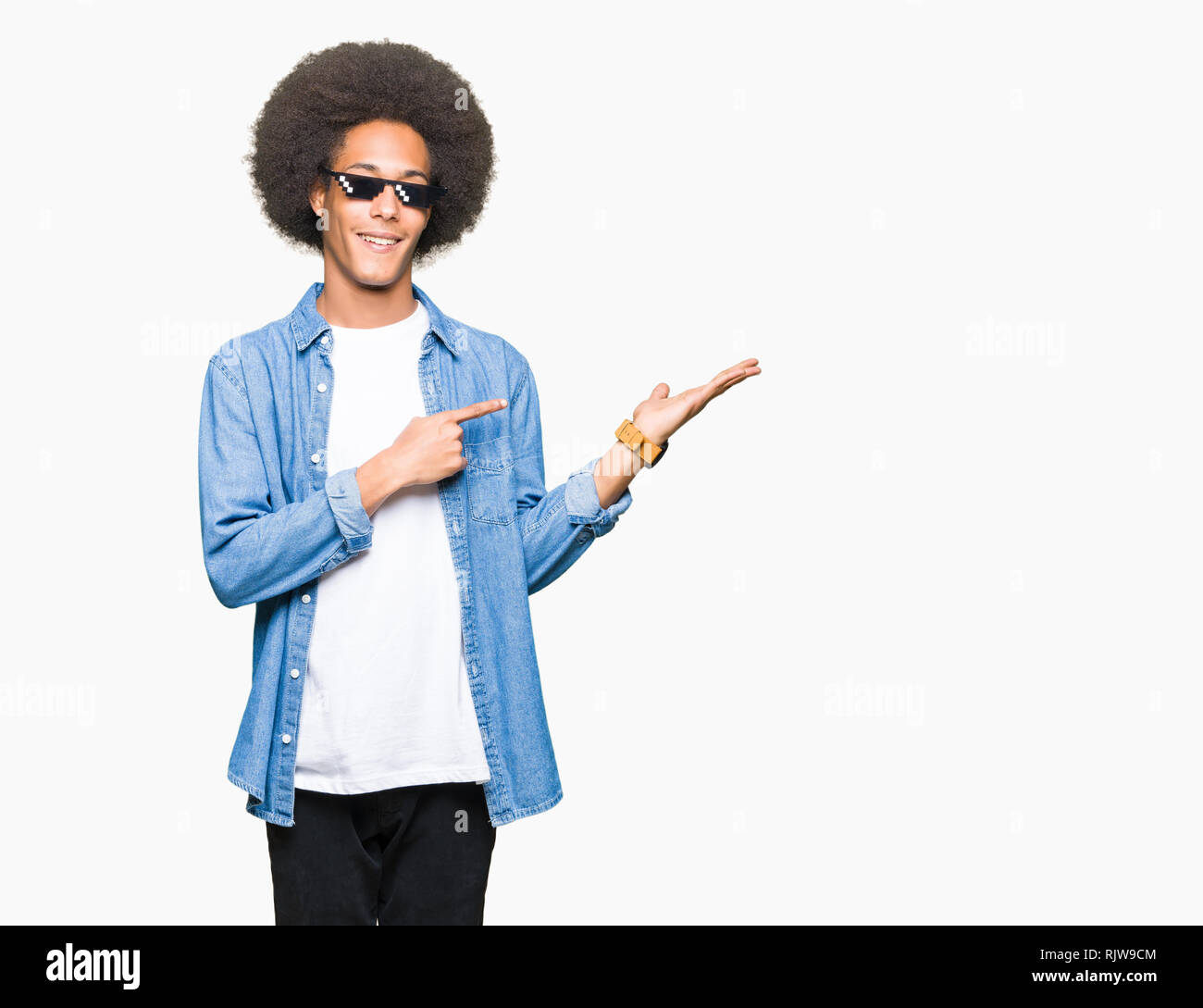 Young african american man with afro hair wearing thug life glasses ...