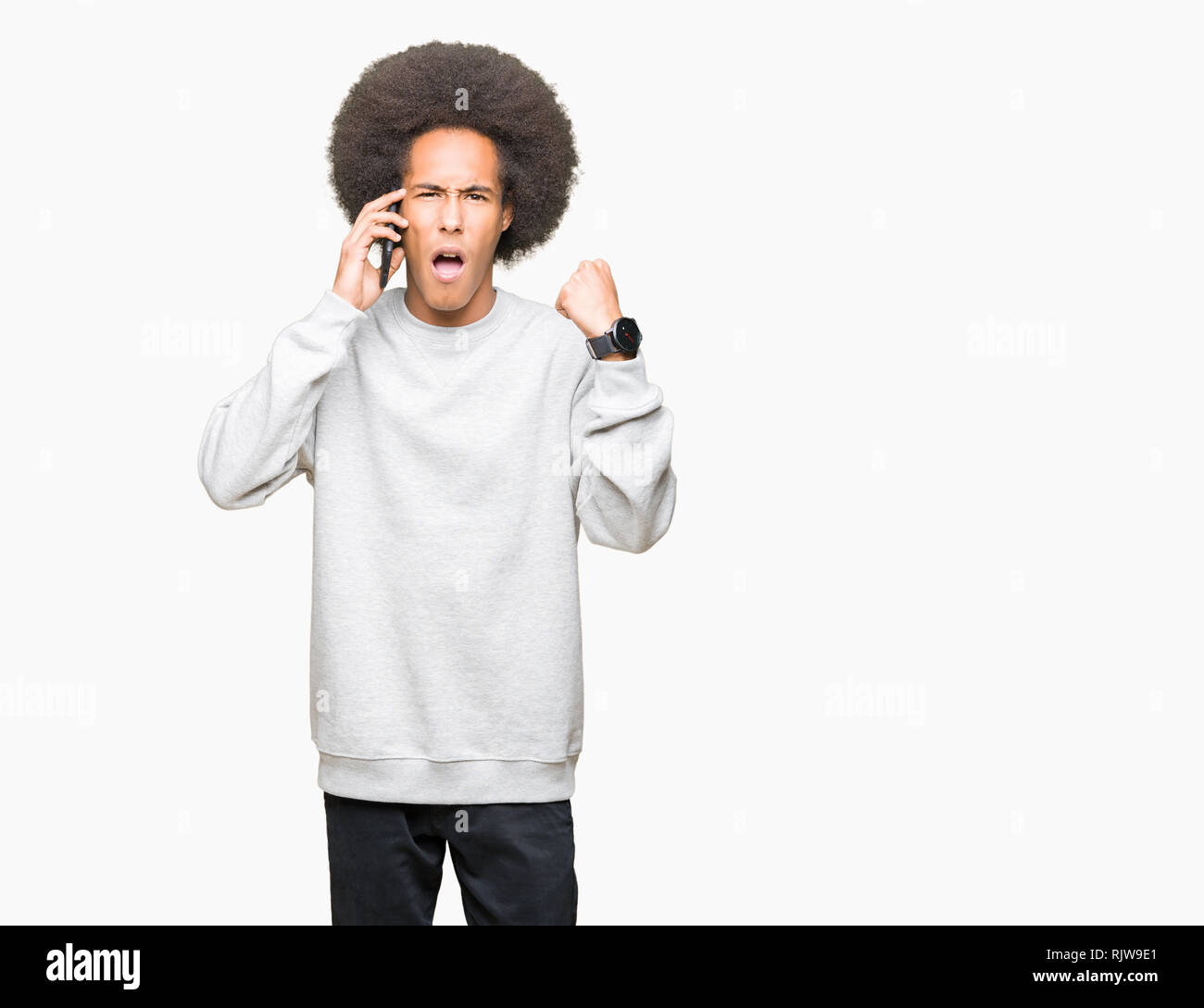 Annoyed angry afro young man Cut Out Stock Images & Pictures - Alamy