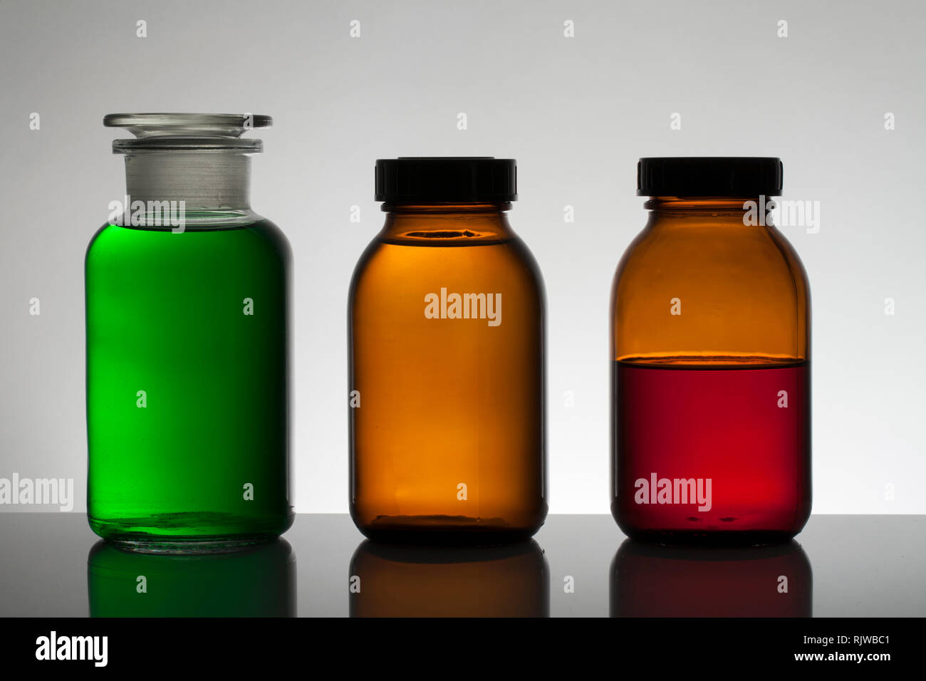 Liquid in laboratory bottles. Scientific biochemical laboratory ...