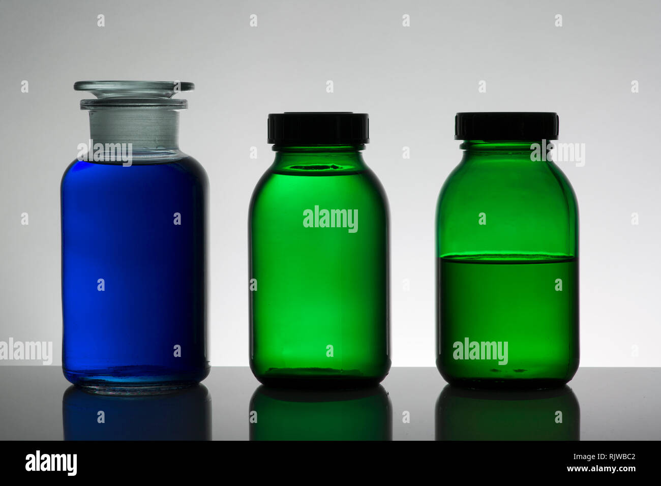 Liquid in laboratory bottles. Scientific biochemical laboratory ...