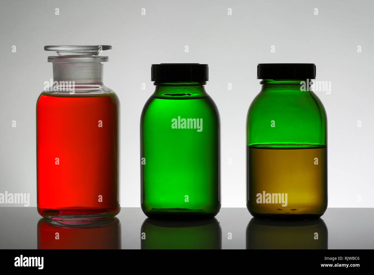 Liquid in laboratory bottles. Scientific biochemical laboratory ...