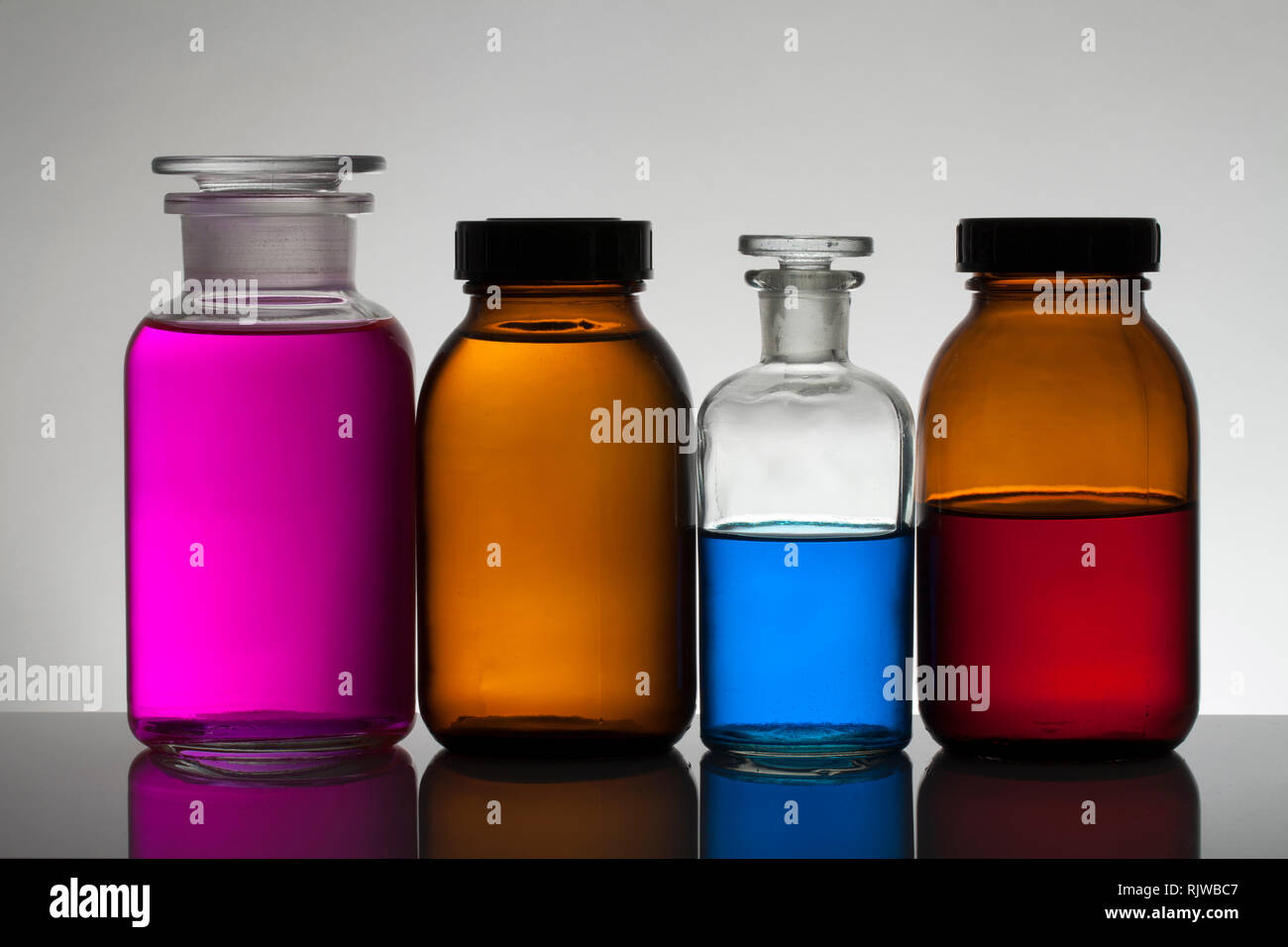 Liquid in laboratory bottles. Scientific biochemical laboratory ...