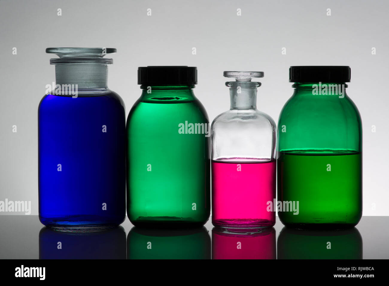 Liquid in laboratory bottles. Scientific biochemical laboratory ...