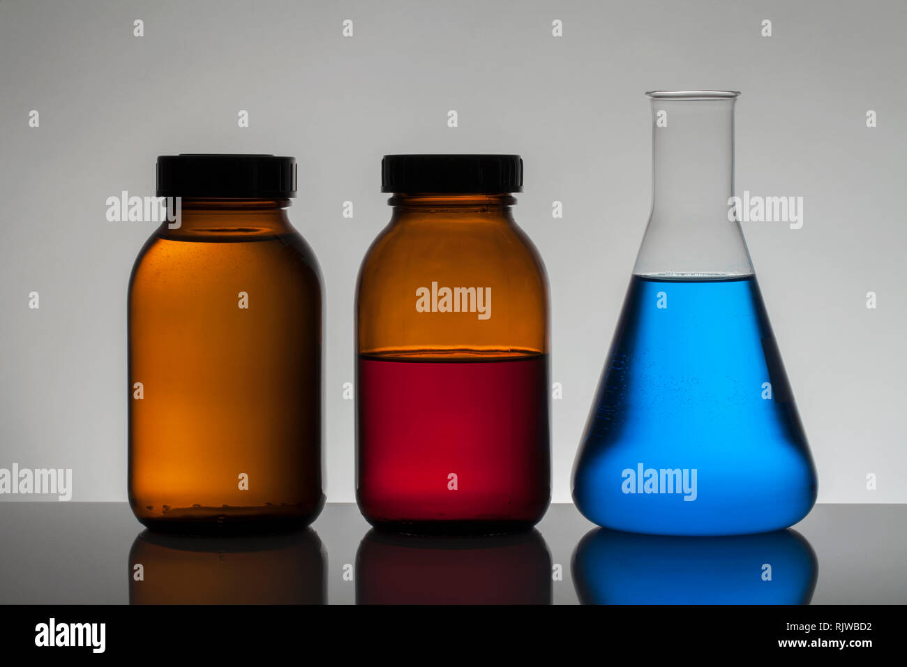 Liquid in laboratory bottles. Scientific biochemical laboratory ...