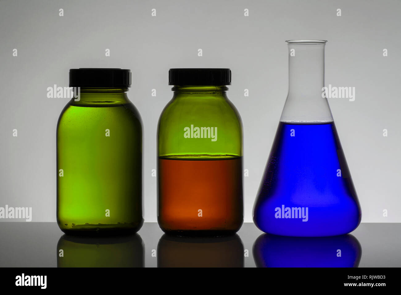 Liquid in laboratory bottles. Scientific biochemical laboratory ...