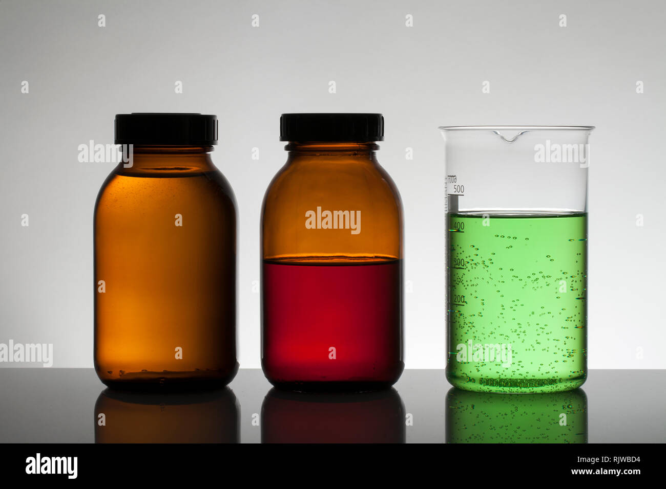 Liquid in laboratory bottles. Scientific biochemical laboratory ...