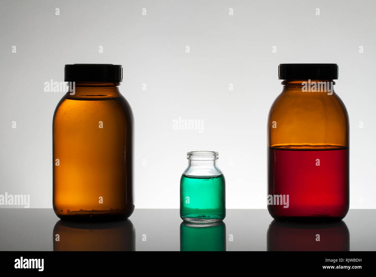 Liquid in laboratory bottles. Scientific biochemical laboratory ...