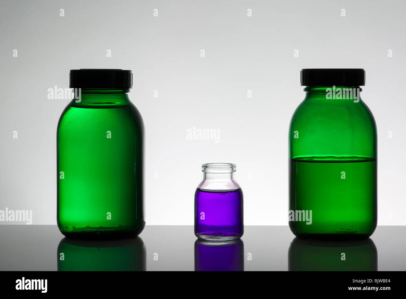 Liquid in laboratory bottles. Scientific biochemical laboratory ...