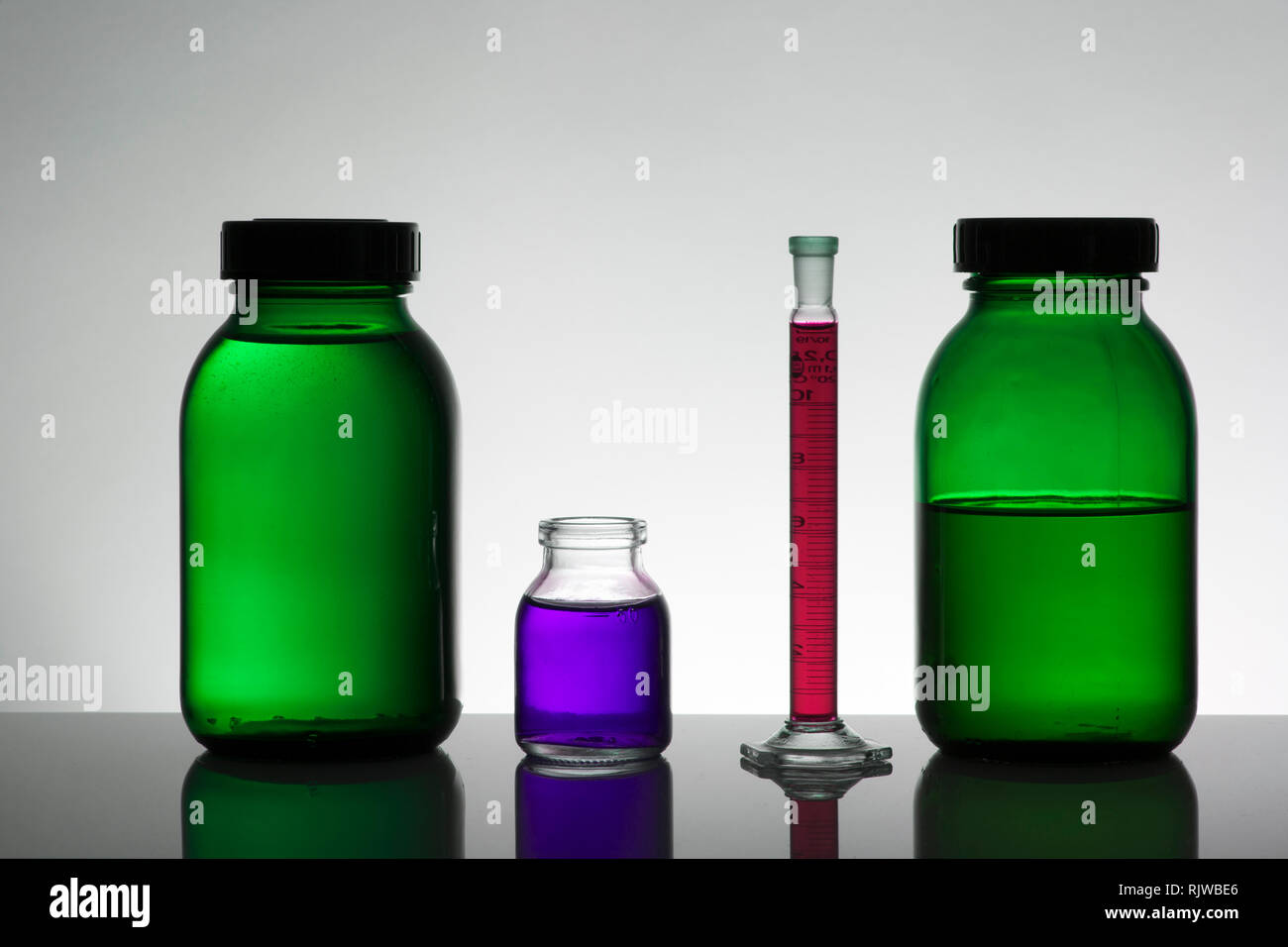 Liquid in laboratory bottles. Scientific biochemical laboratory ...