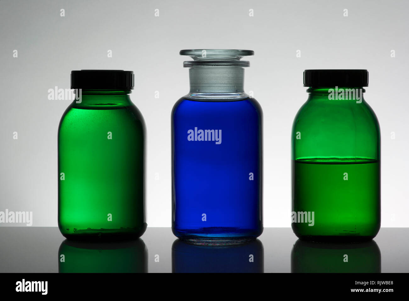 Liquid in laboratory bottles. Scientific biochemical laboratory ...